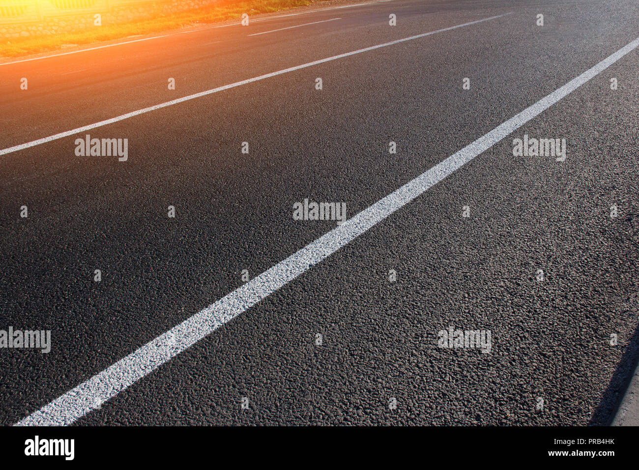 Asphalt road with marking lines white stripes Stock Photo - Alamy