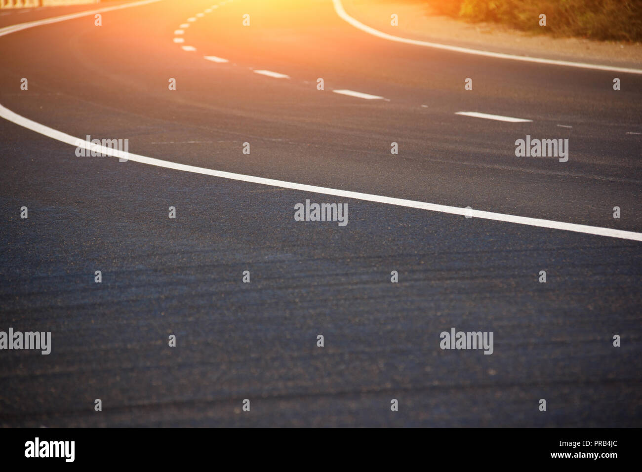 Asphalt road with marking lines white stripes Stock Photo - Alamy