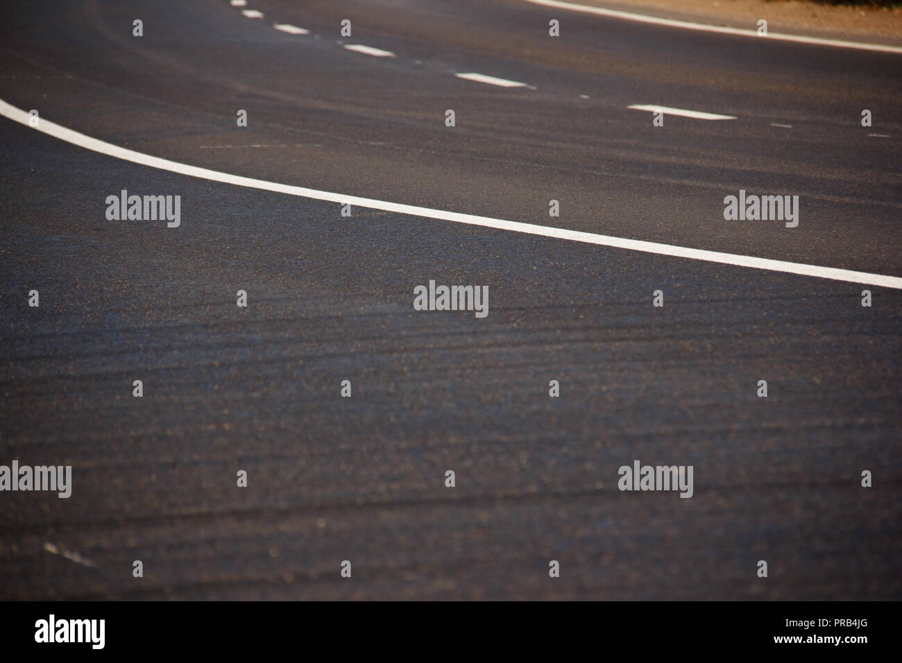 Asphalt road with marking lines white stripes Stock Photo - Alamy