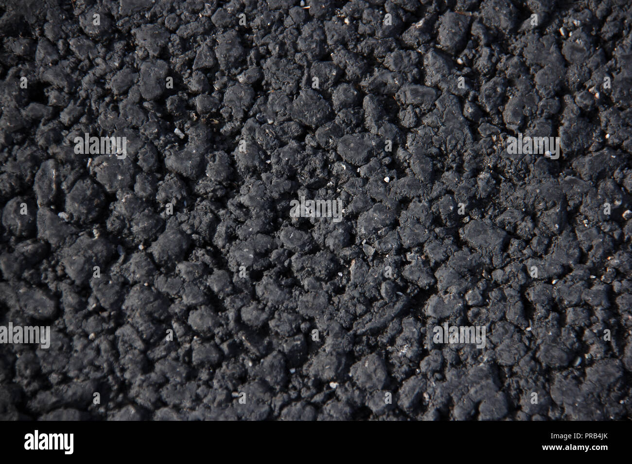 black tarmac texture useful as a background Stock Photo - Alamy