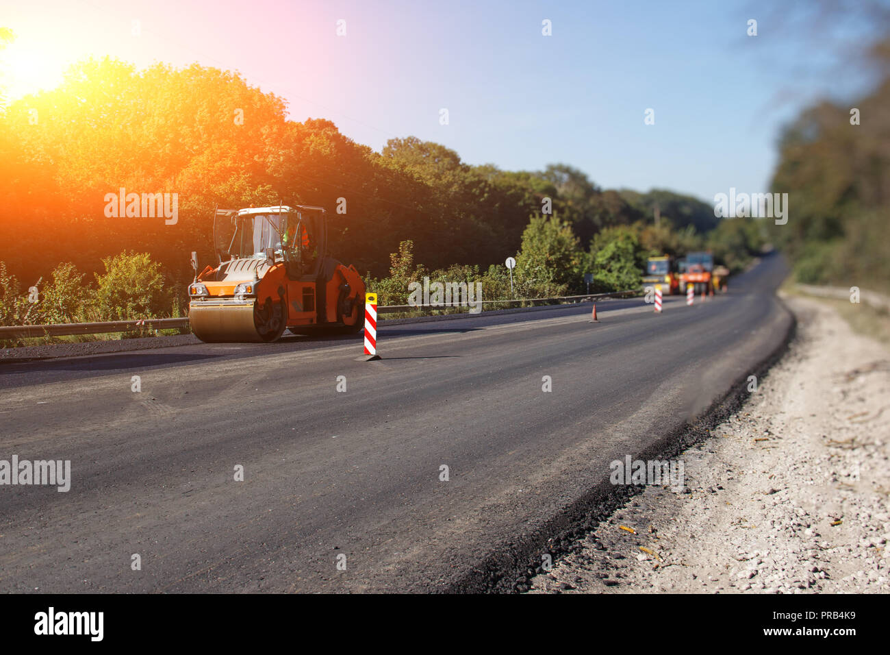 Industrial truck laying fresh bitumen hi-res stock photography and ...