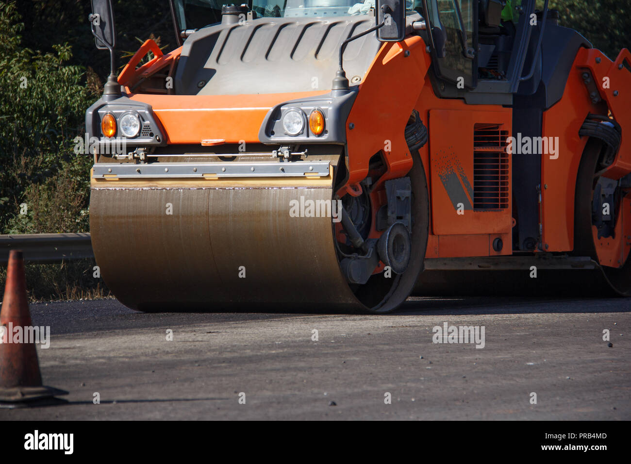 Industrial truck laying fresh bitumen hi-res stock photography and ...