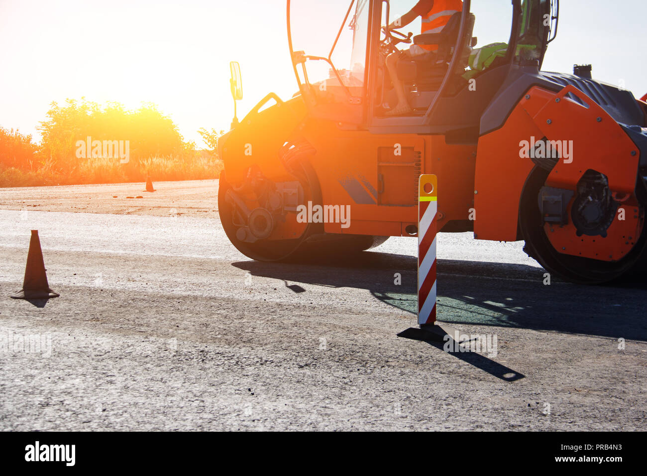 Industrial truck laying fresh bitumen hi-res stock photography and ...
