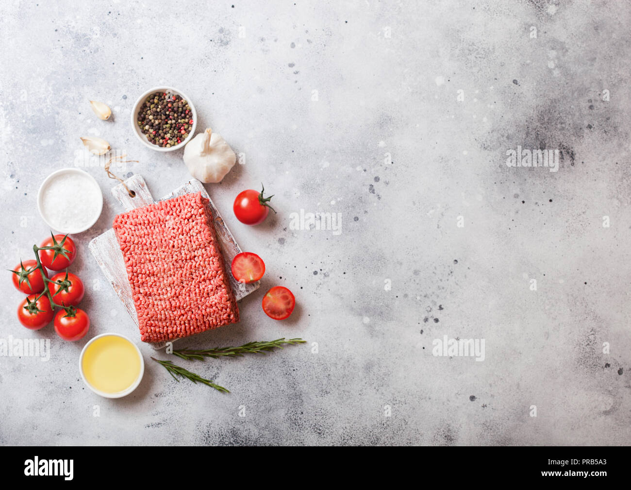 Raw minced homemade beef meat with spices and herbs. Top view. On top ...