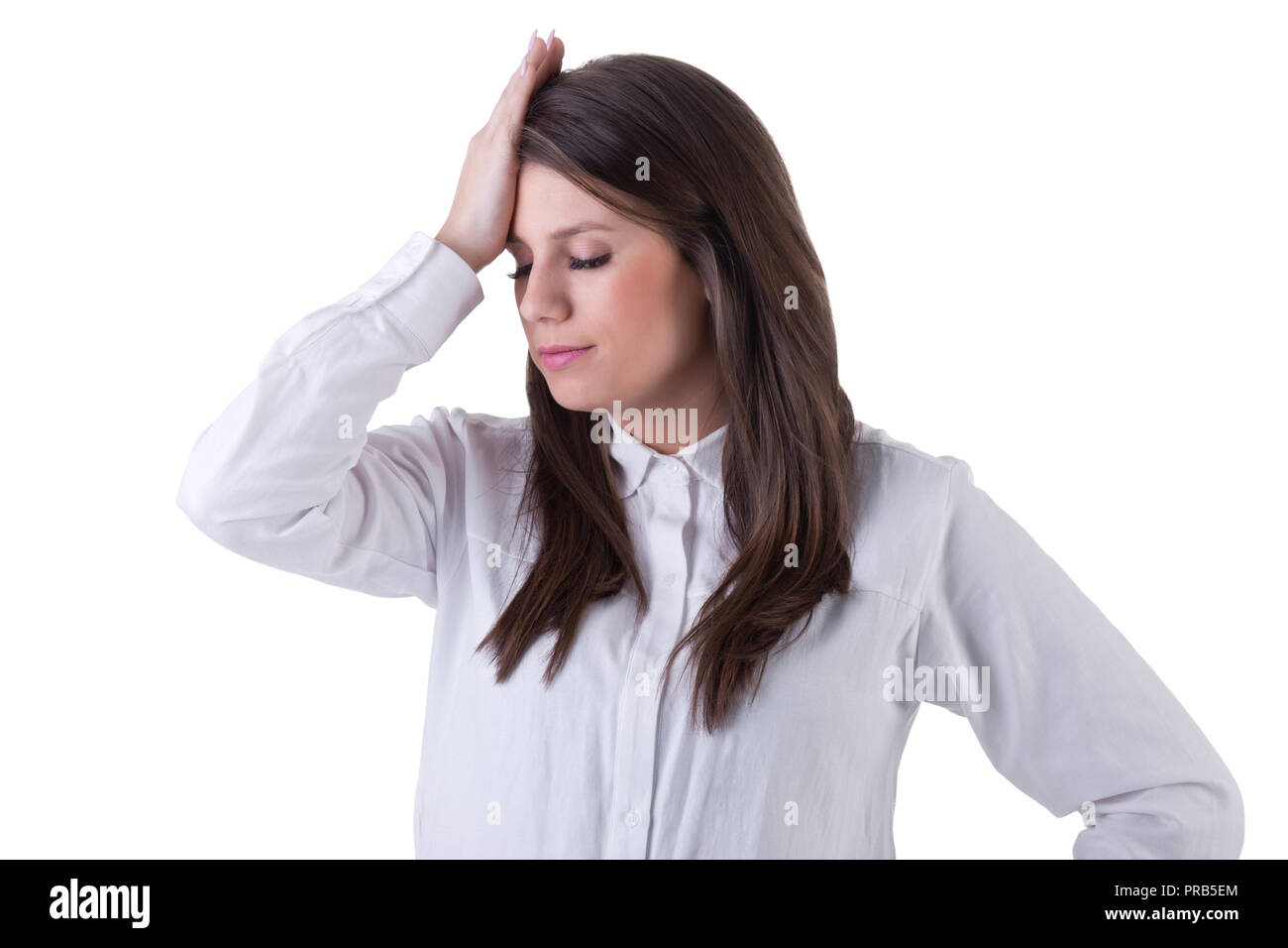 Girl holding her hand to her forehead in a sign of trouble, isolated in ...