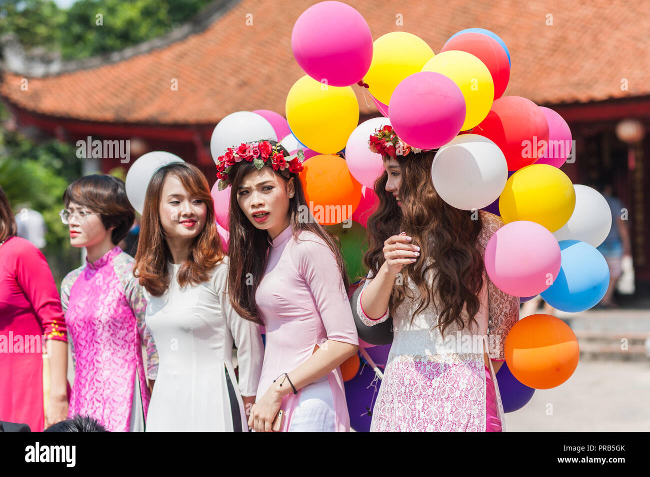 Hanoi, Vietnam - October 16, 2016. Group of students dressed in formal ...