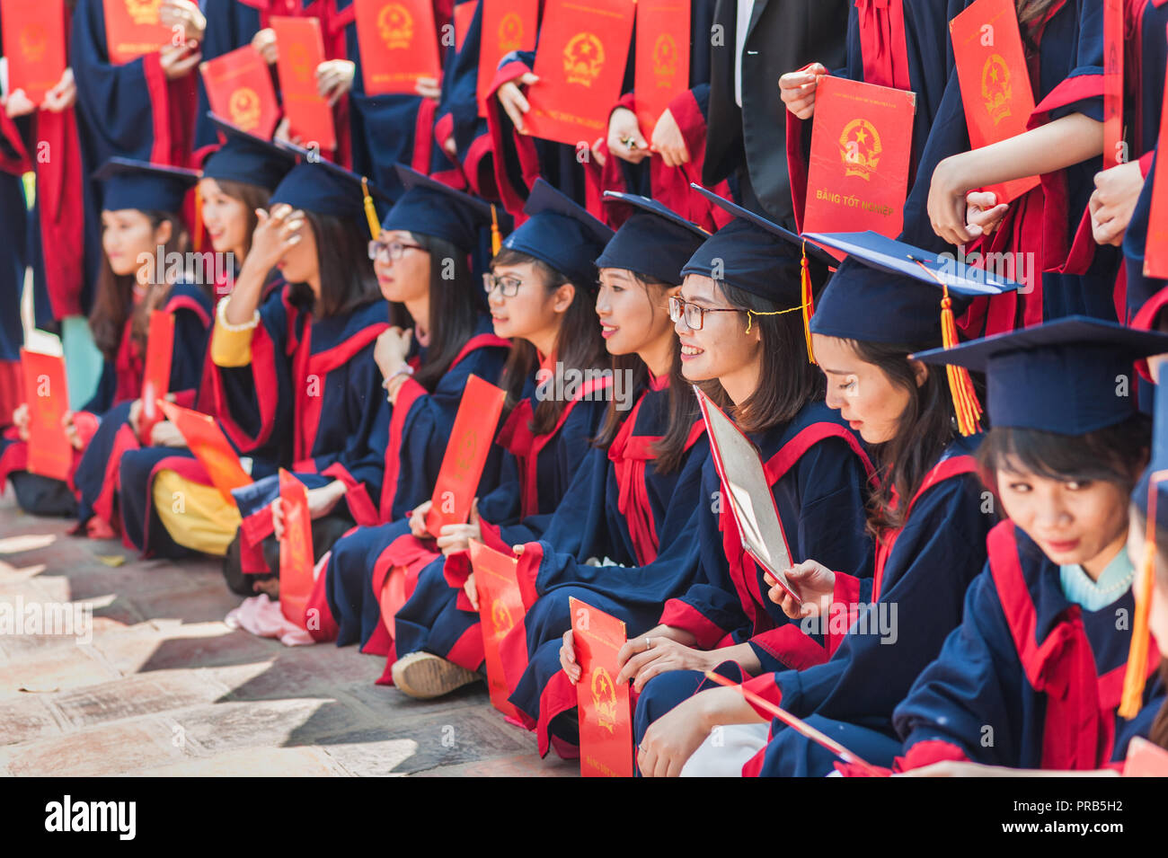 Hanoi, Vietnam - October 16, 2016. Group of students dressed in caps ...