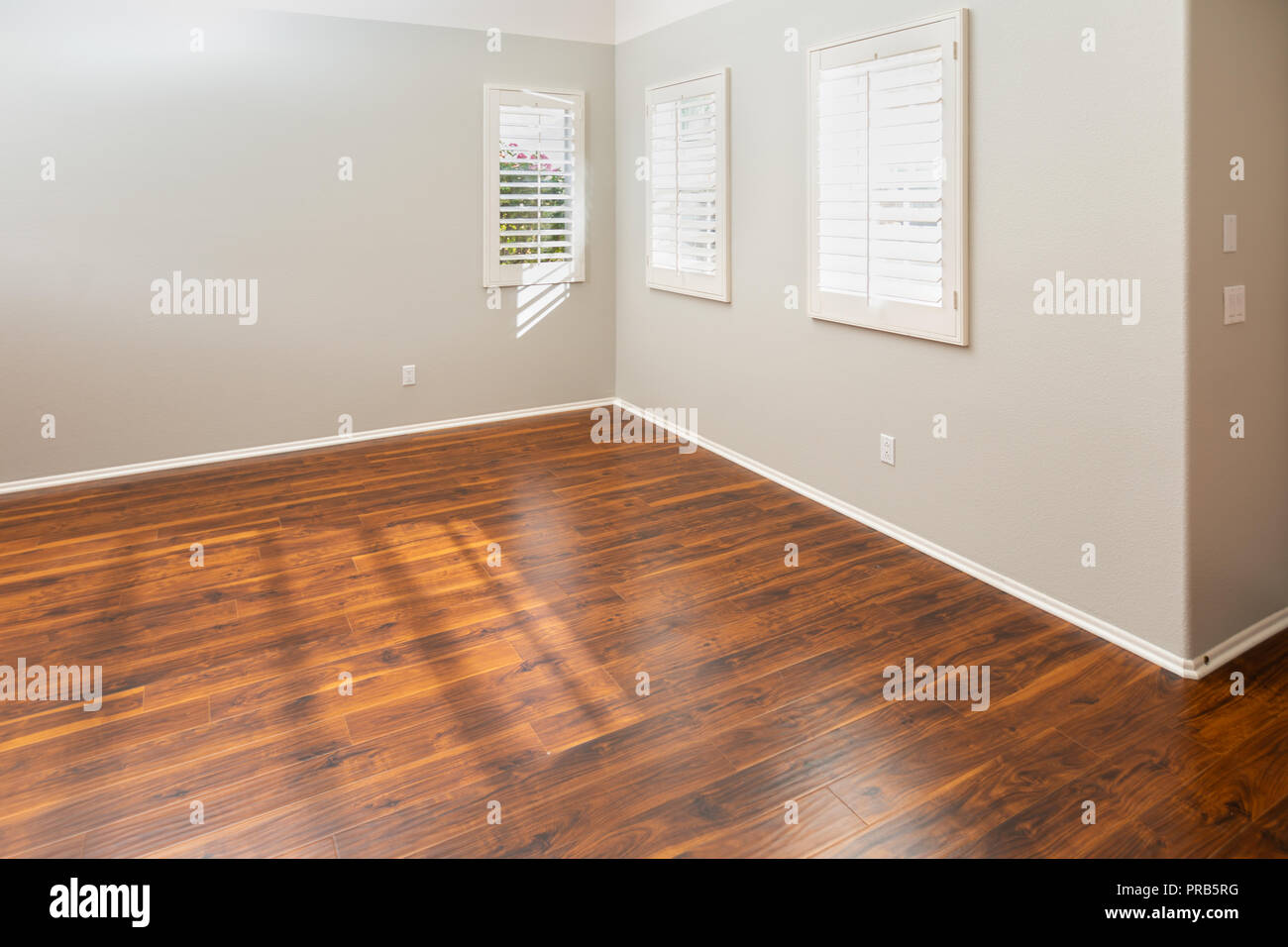 Newly Installed Brown Laminate Flooring and Baseboards in Home Stock ...