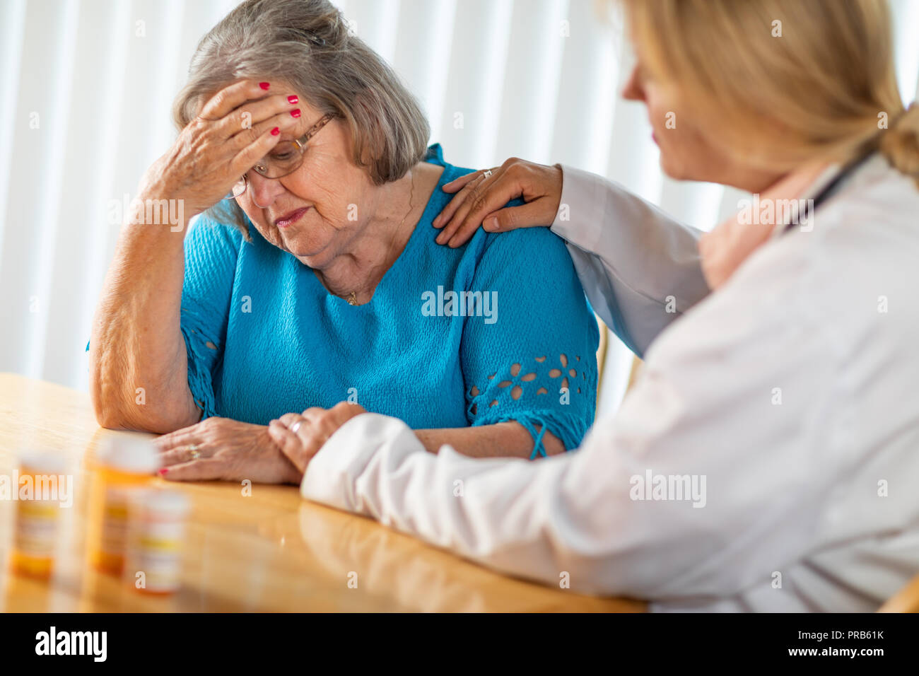 Doctor and distraught patient hi-res stock photography and images - Alamy