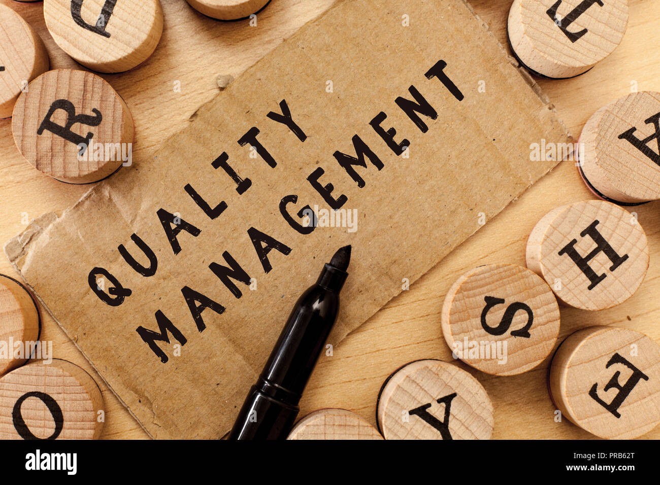 Handwriting text writing Quality Management. Concept meaning Maintain ...