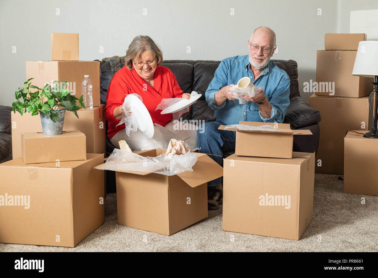 Elderly moving home packing hi-res stock photography and images - Alamy