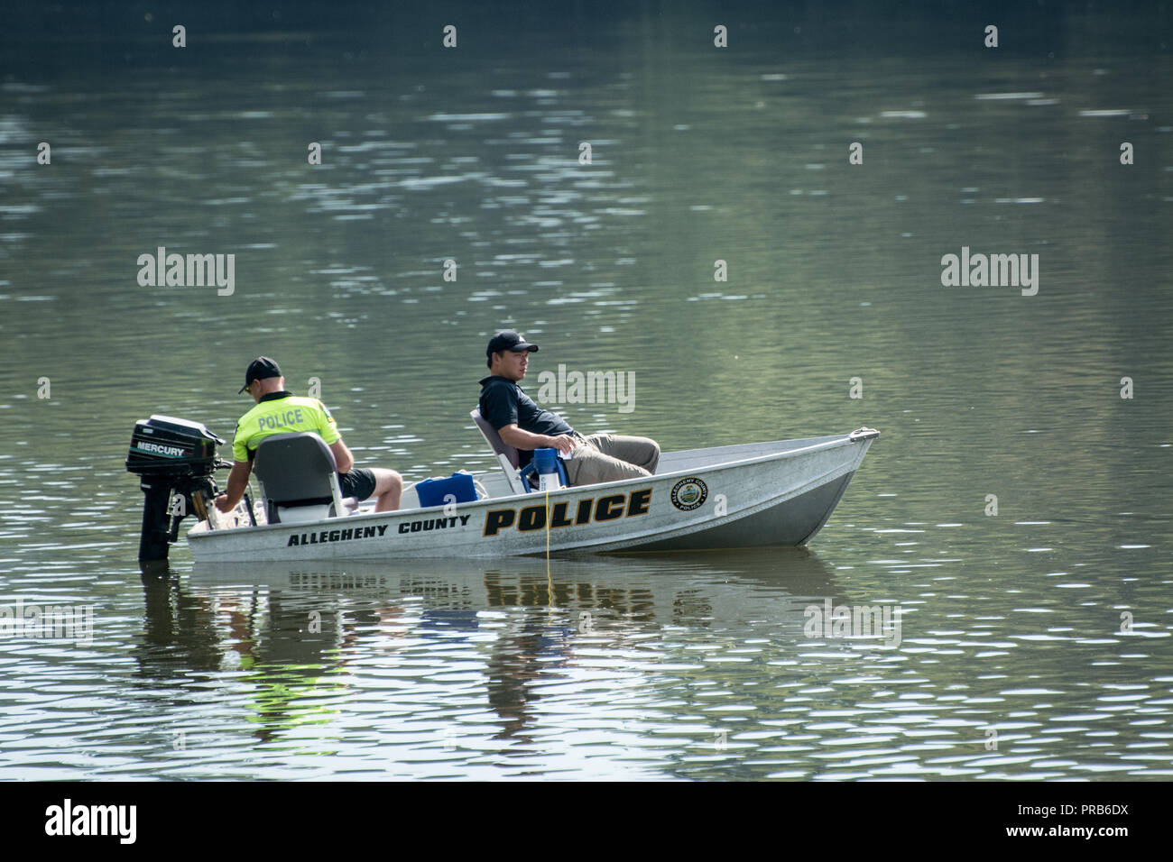 Two Allegheny county police officers in a motor boat patrolling North ...