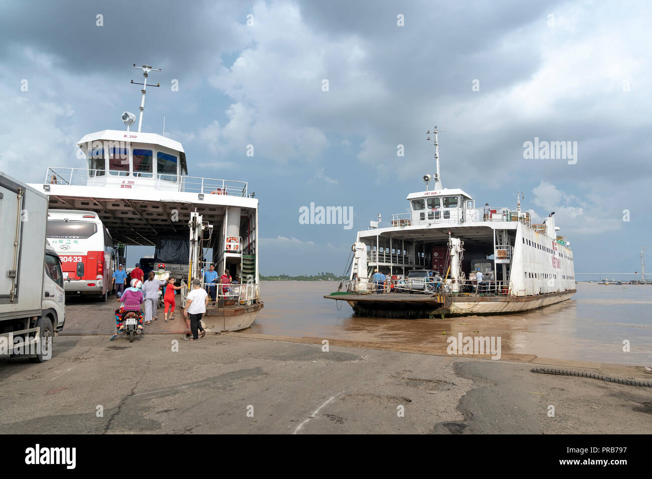 Big ferry transporting cars and passengers across the Hau Giang river ...