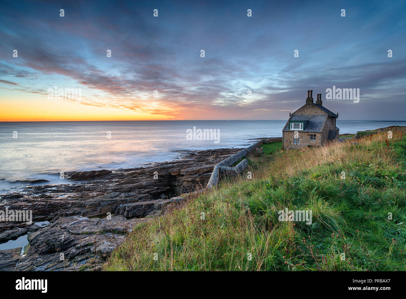 Dawn over the Old Bathing House at Howick on the Northumberland coast ...