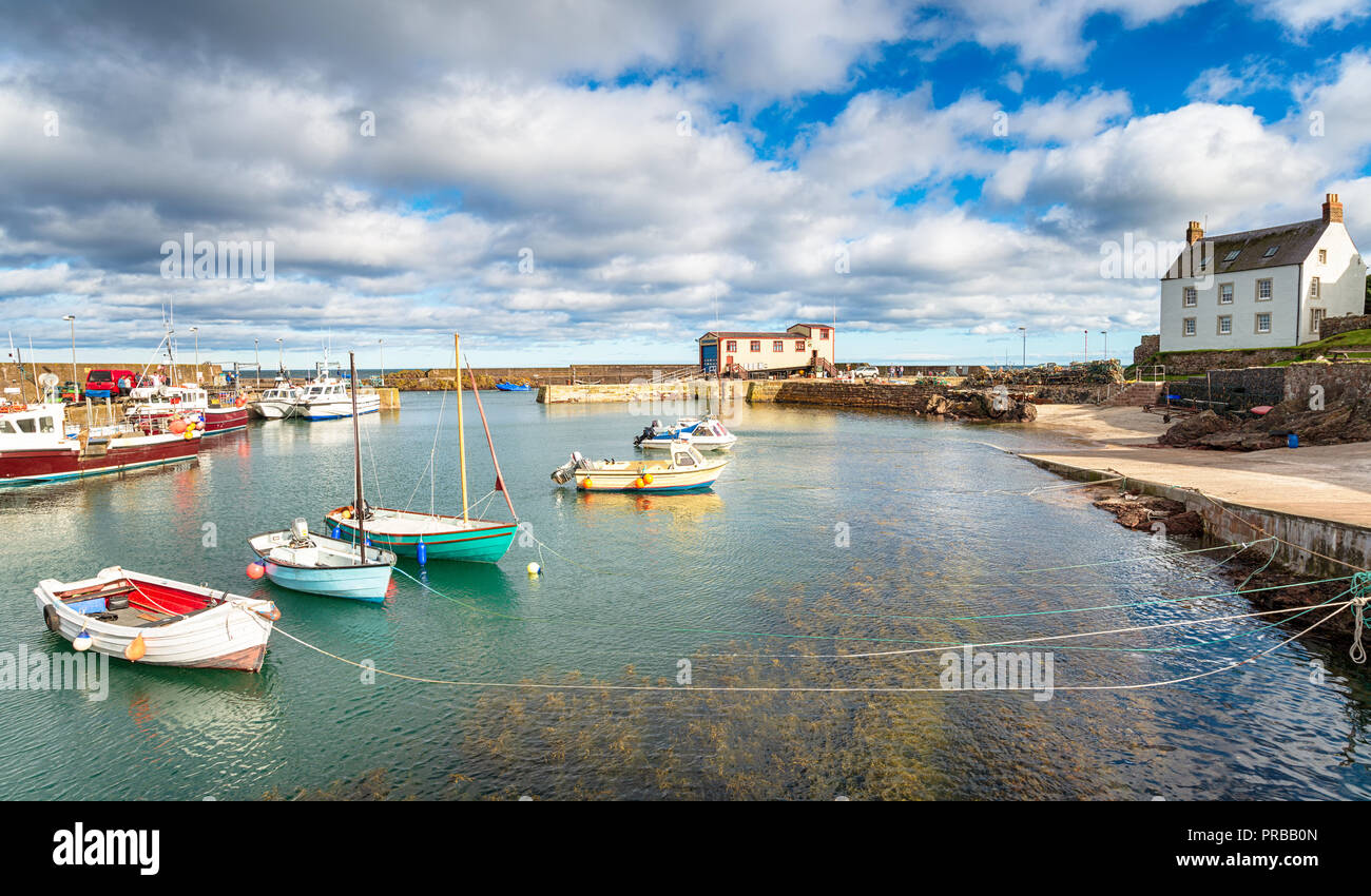 Fishing boats in the harbour at St Abbs, a pretty village in ...