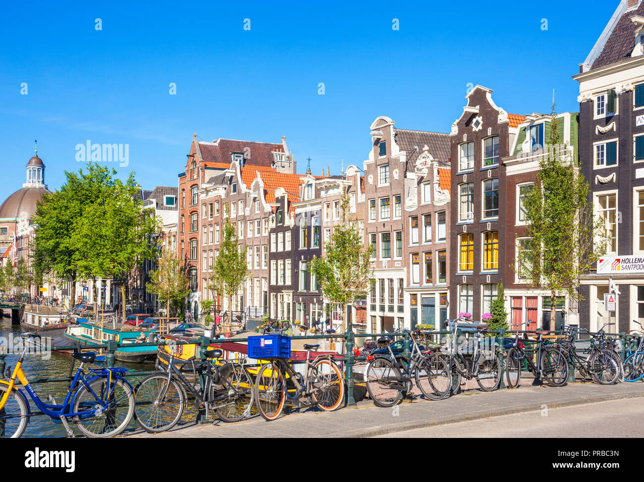 Amsterdam houses and bikes on Singel an Amsterdam canal Blauwburgwal bridge over Singel canal ...