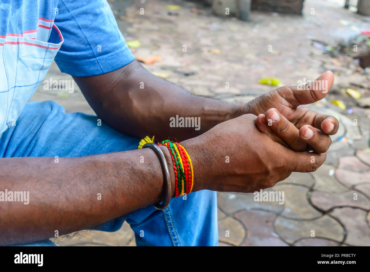 Close up of a mans hand preparing Chewing tobacco. It is a type of ...