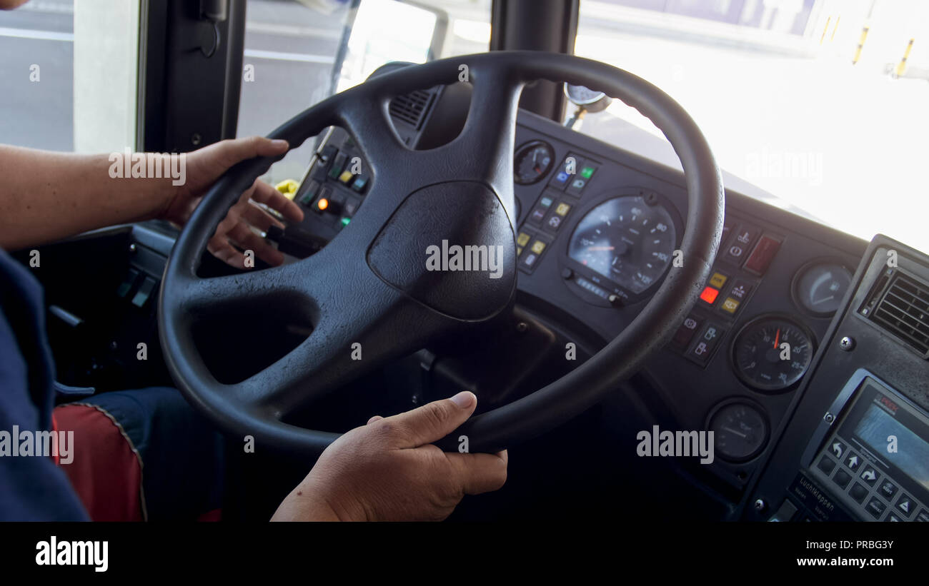 Closeup photo of driver driving big truck Stock Photo - Alamy