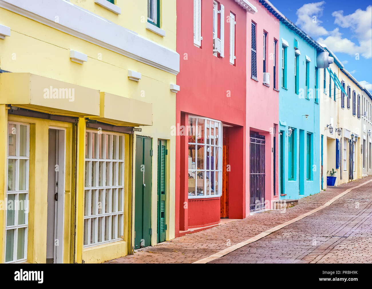 Shops along a street on Bermuda of many different colors Stock Photo ...