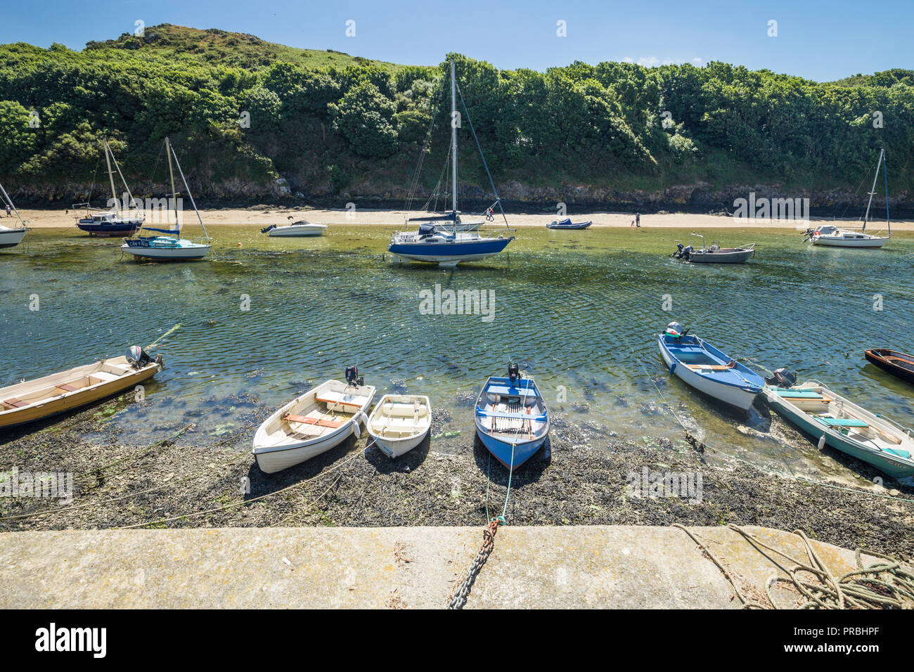 Coastal boats and yachts of Solva harbour at bright sunny summer day ...