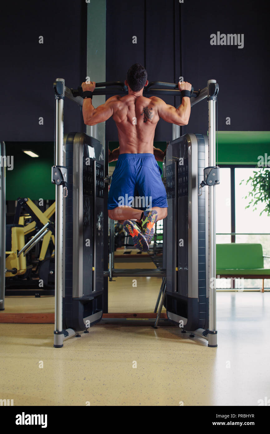 Man doing back training in the gym Stock Photo - Alamy