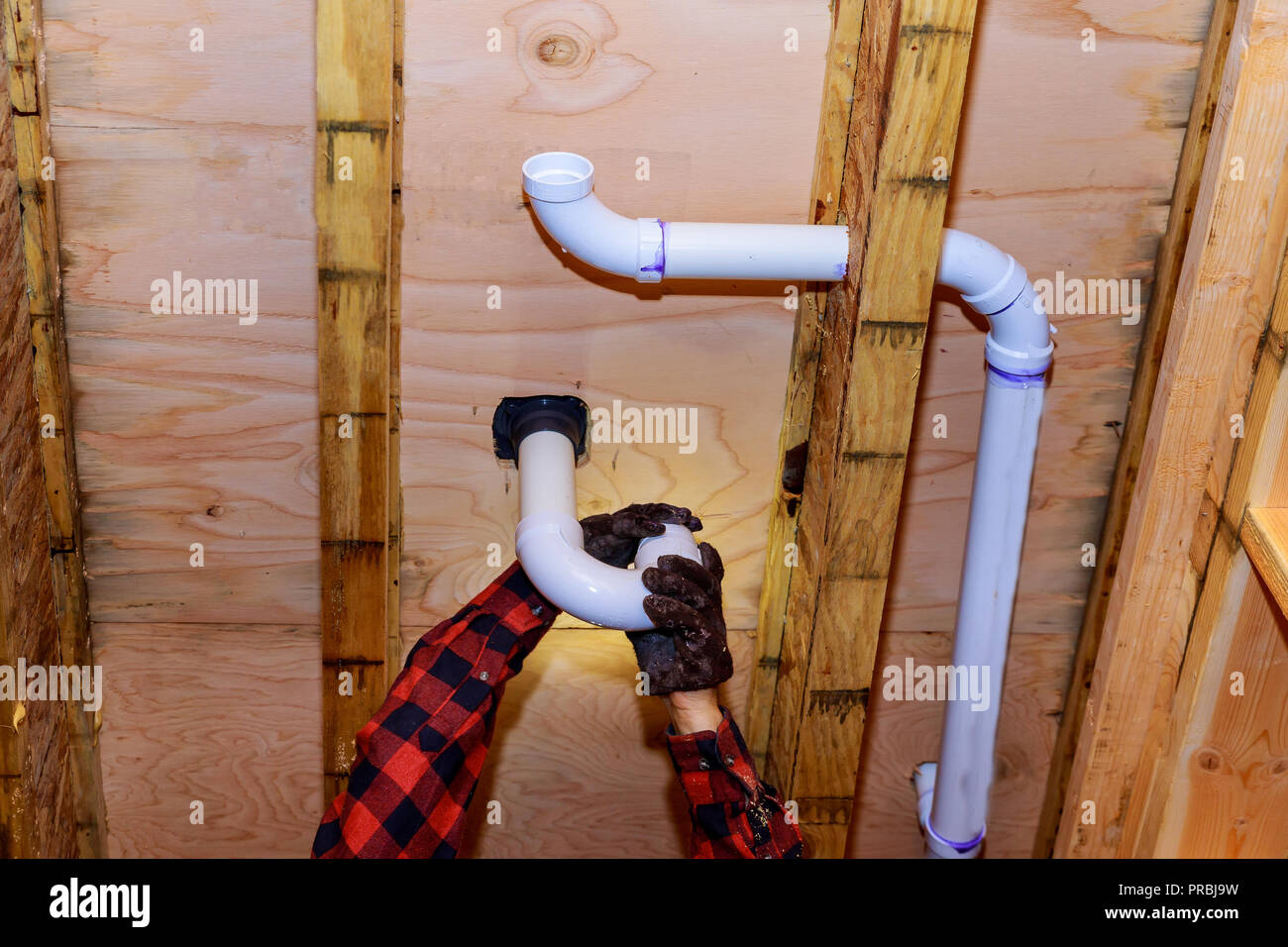 Under the bathroom sink pluming system joinder of the installing PVC ...