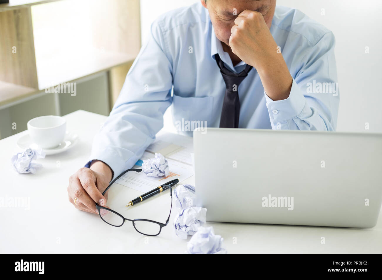 Depressed failure and tired businessman late sad and solving problem in ...