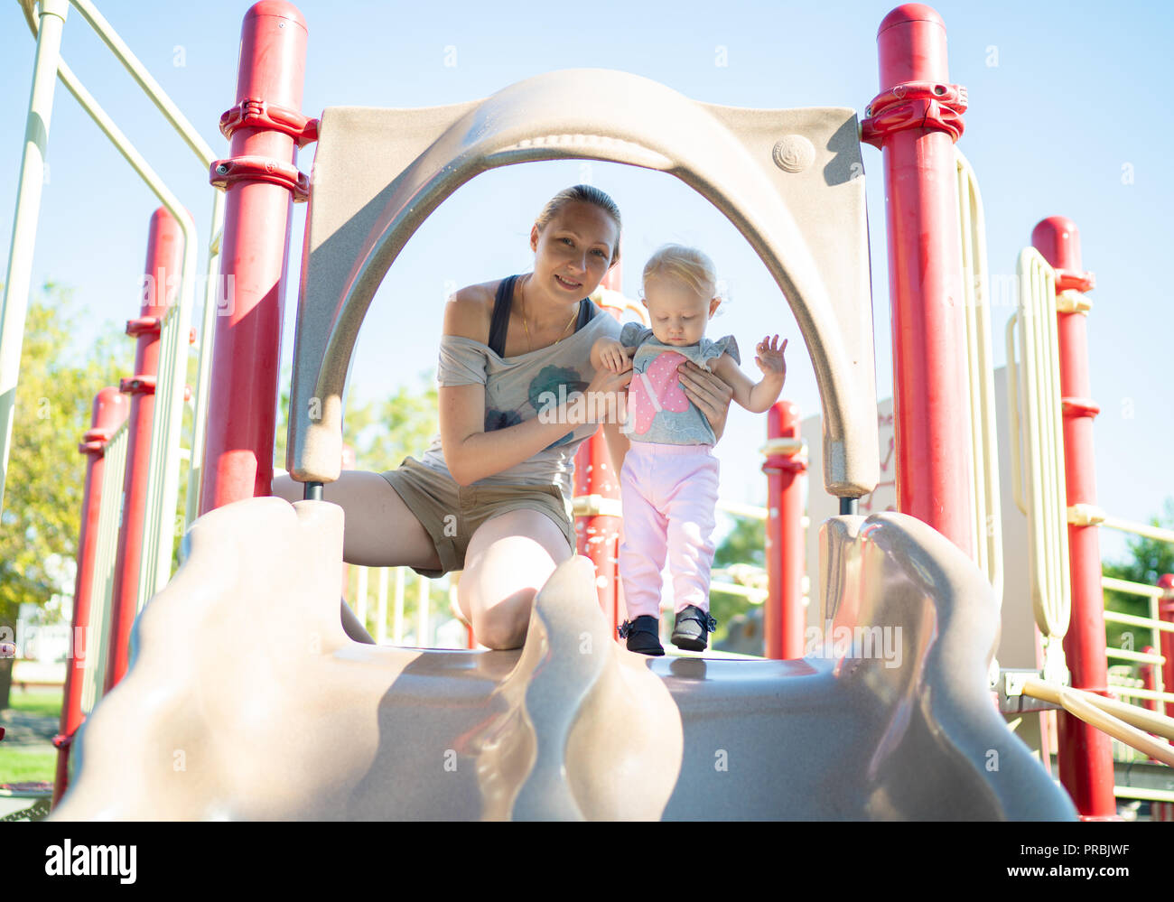 Children playing at playground Stock Photo - Alamy