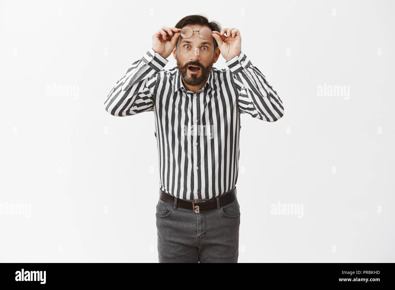 Guy cannot believe own eyes, taking off glasses and staring at monument ...