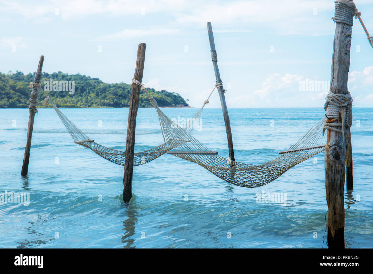 Cot for relaxing at the sea with freshness of nature Stock Photo - Alamy
