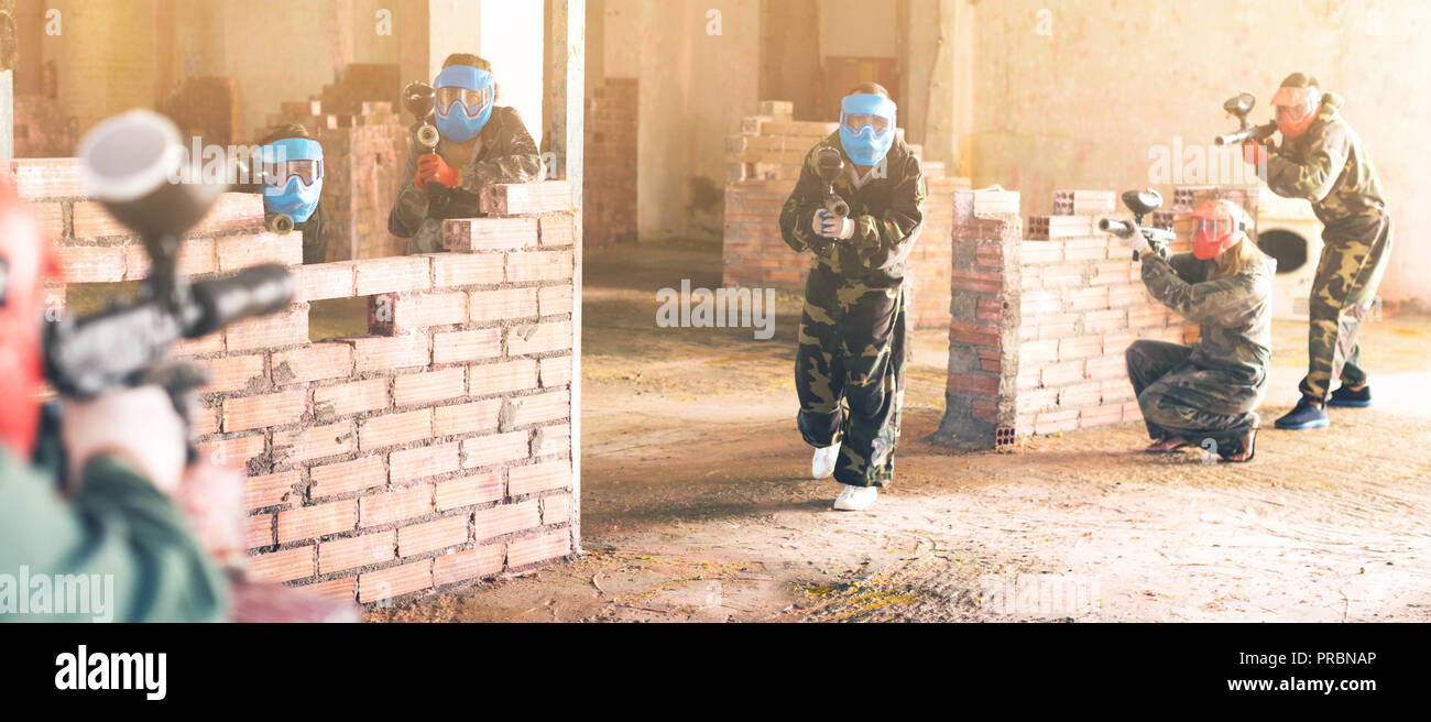 Players are having fun on the battlefiled on the paintball court Stock ...