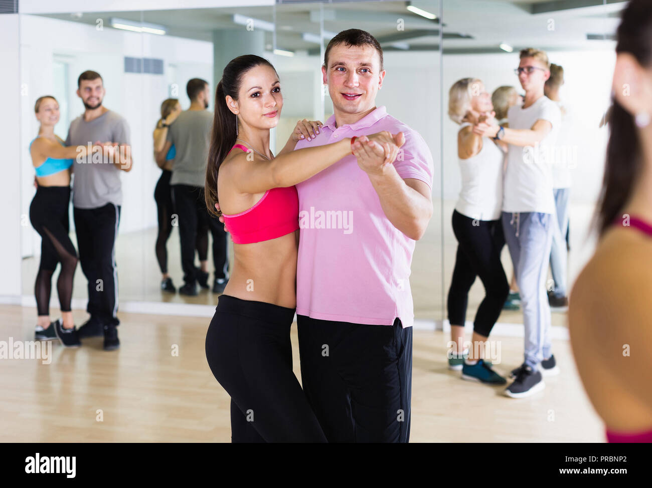 happy germany men and women of different ages dancing salsa in dance ...