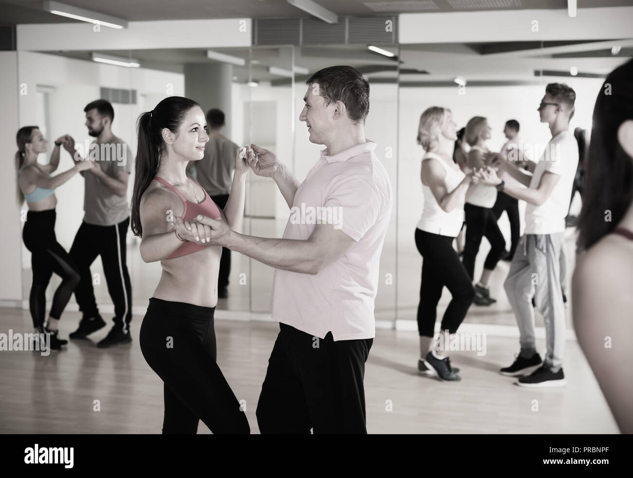 Joyful dancing pair dance tango together in studio Stock Photo - Alamy