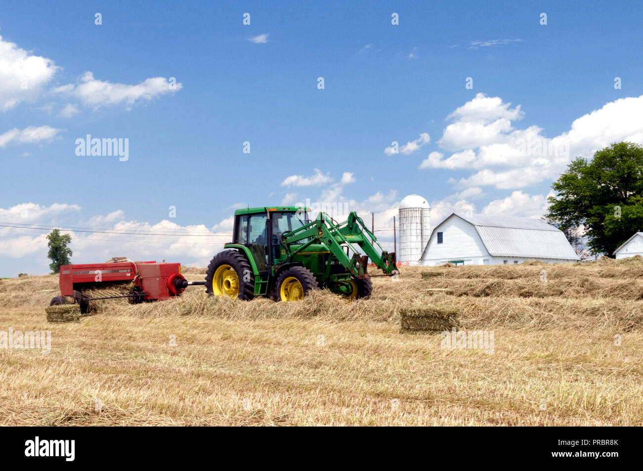 2008 - Farmer on a John Deere 6400 tractor pulling a Case SBX 540 hay ...