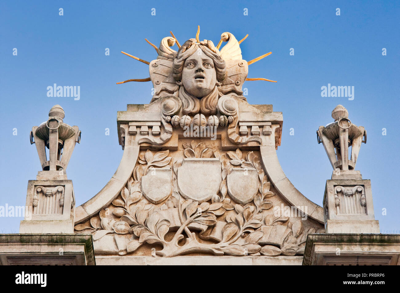 Portico with head of Apollo crowned with a sun halo at Art Nouveau ...
