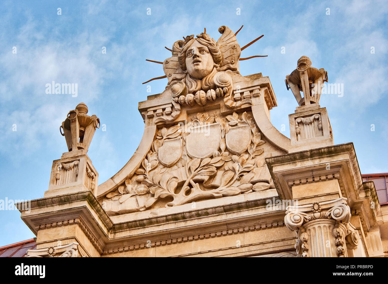 Portico with head of Apollo crowned with a sun halo at Art Nouveau ...