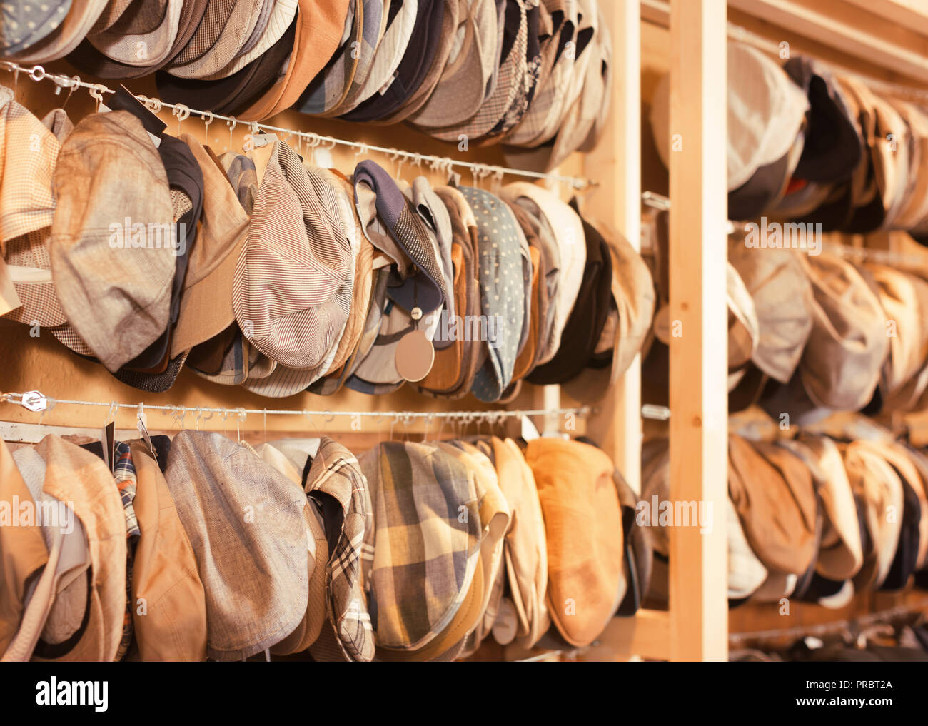 Modern berets hanging on the wall in the shopping mall Stock Photo - Alamy