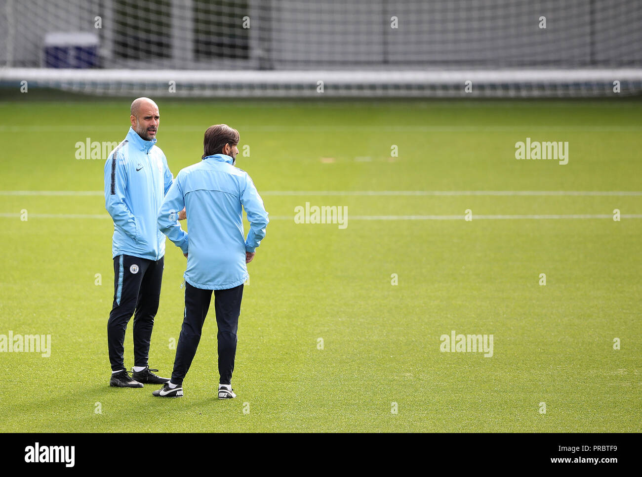 Manchester City manager Pep Guardiola (left) and fitness coach Lorenzo ...