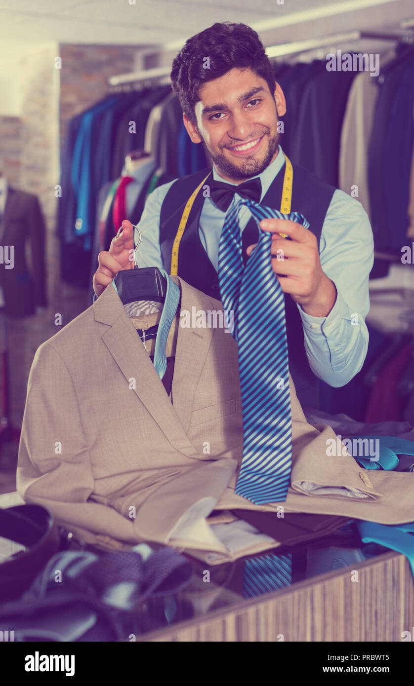 Designer is creating business image in men's clothes shop Stock Photo ...