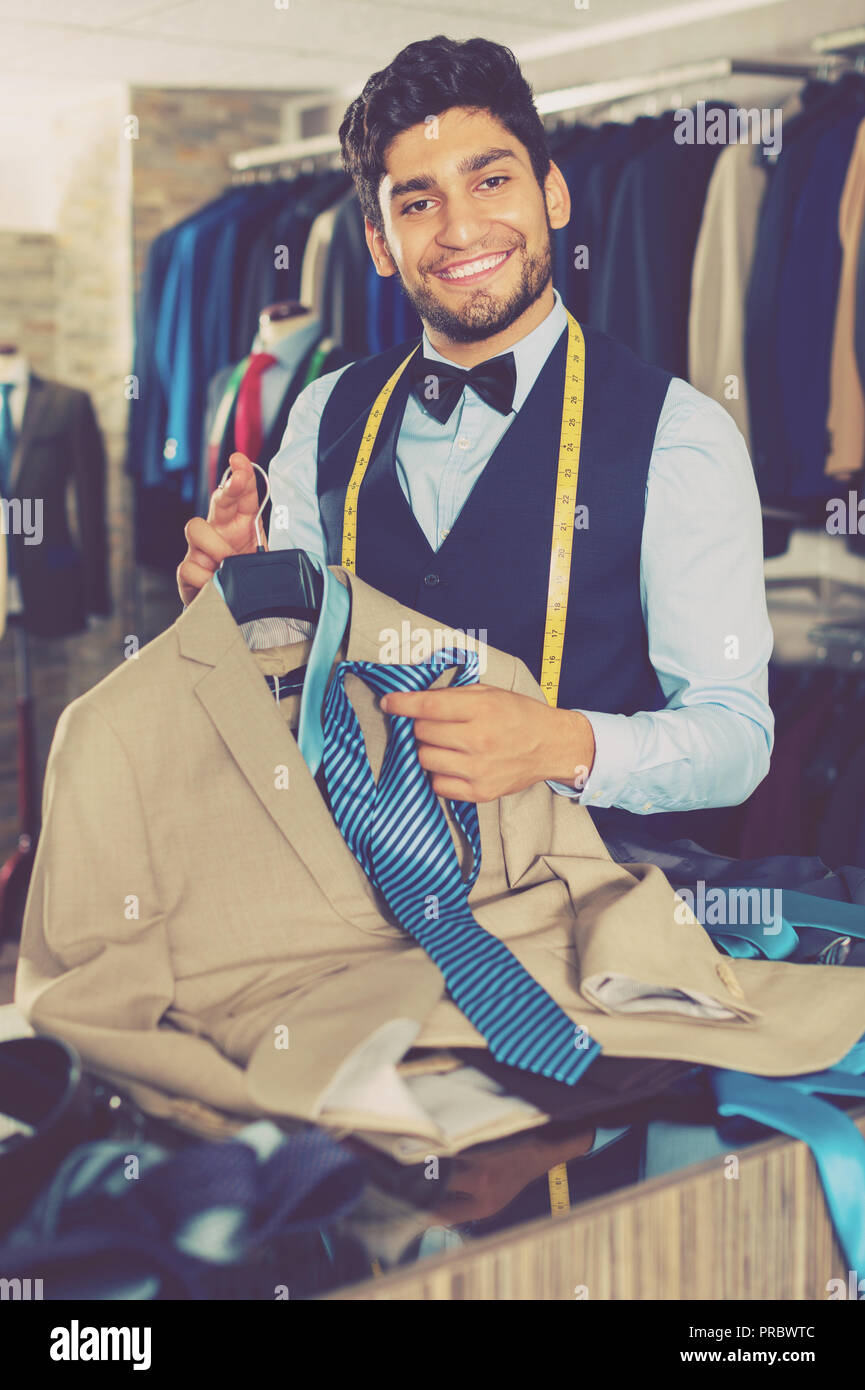 Male designer is creating business image in men's clothes shop Stock ...