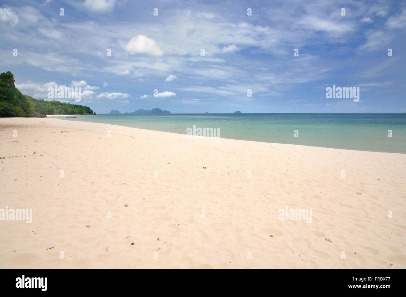 Paradise Thung San beach with white sand and rocky limestone cliff at ...