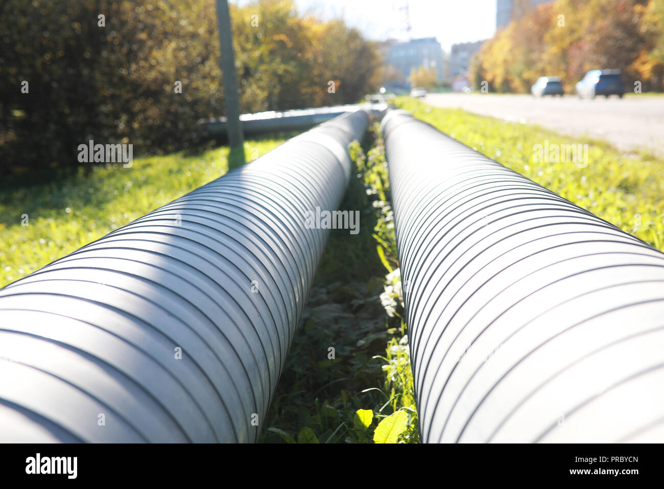Industrial pipes on street construction Stock Photo - Alamy