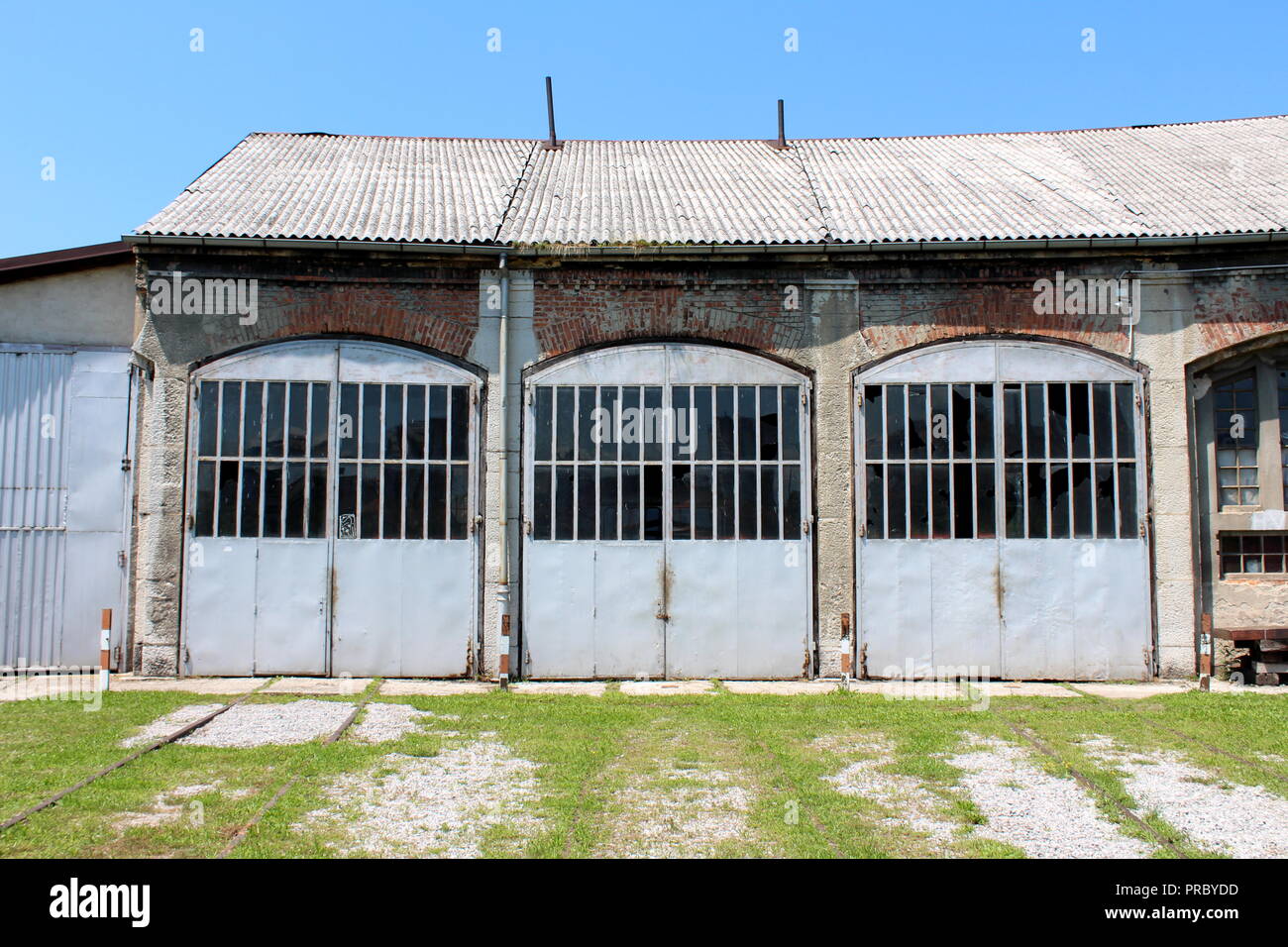 Entrance to large old train station repair workshop red brick building ...