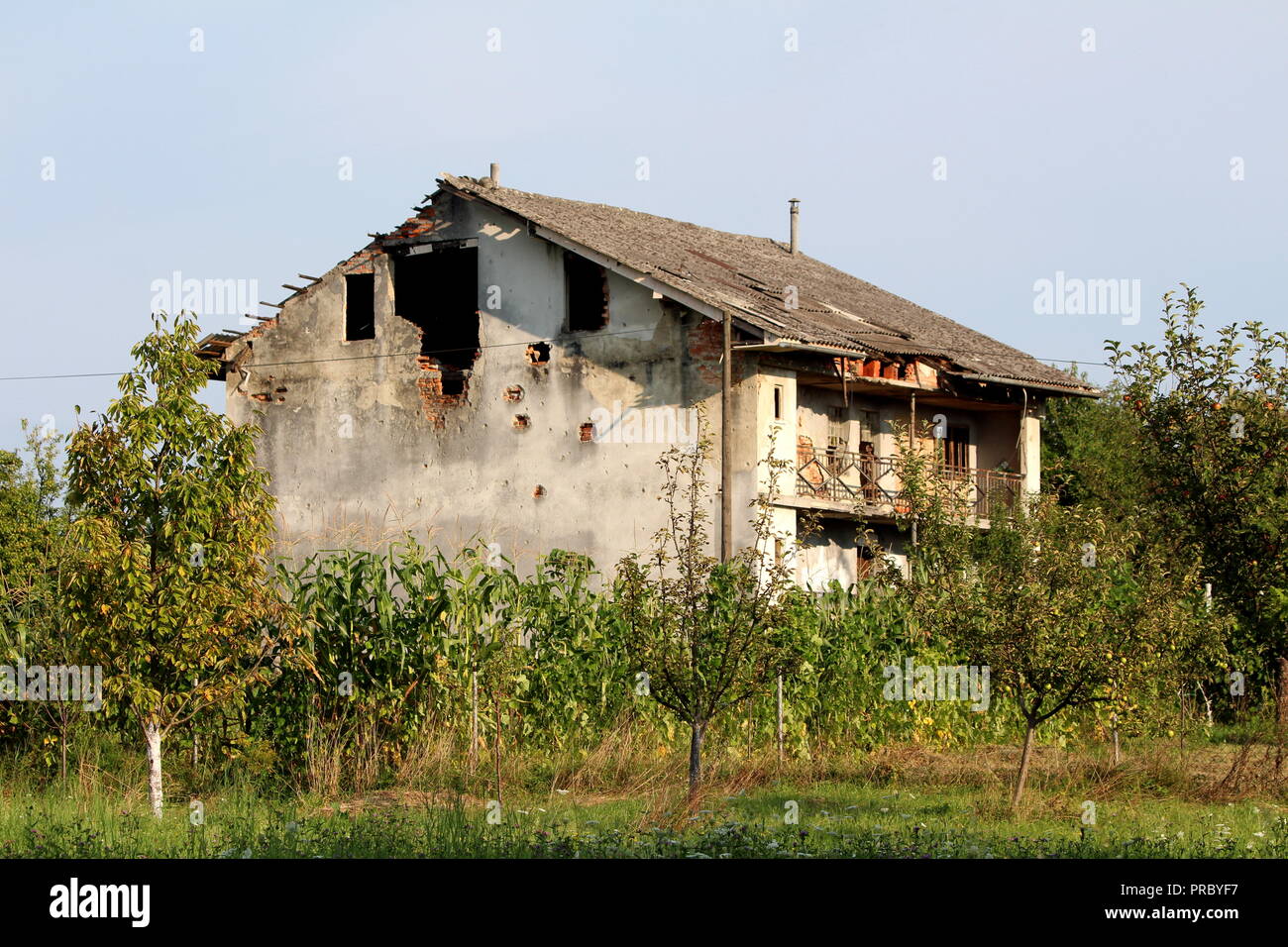 Family house abandoned after war left with damaged exterior and ...