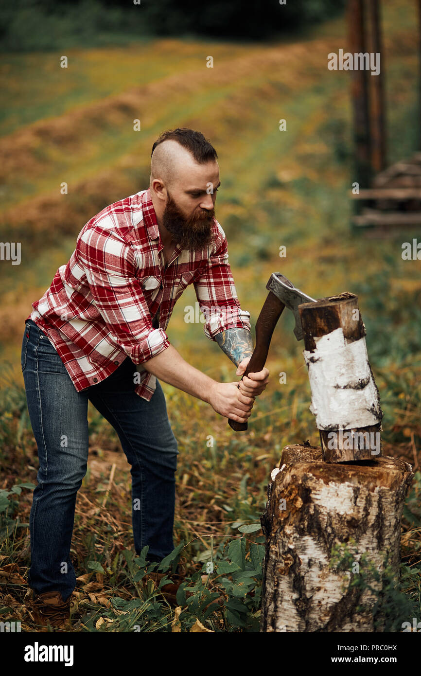 Strong woodcutter chopping wood in hi-res stock photography and images ...