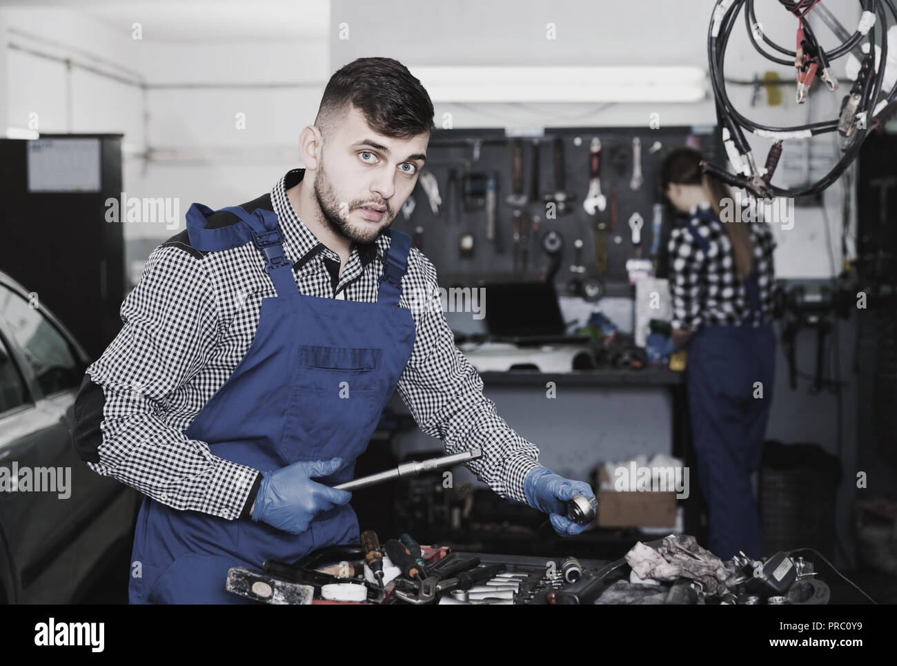 Male worker choosing instruments hi-res stock photography and images ...