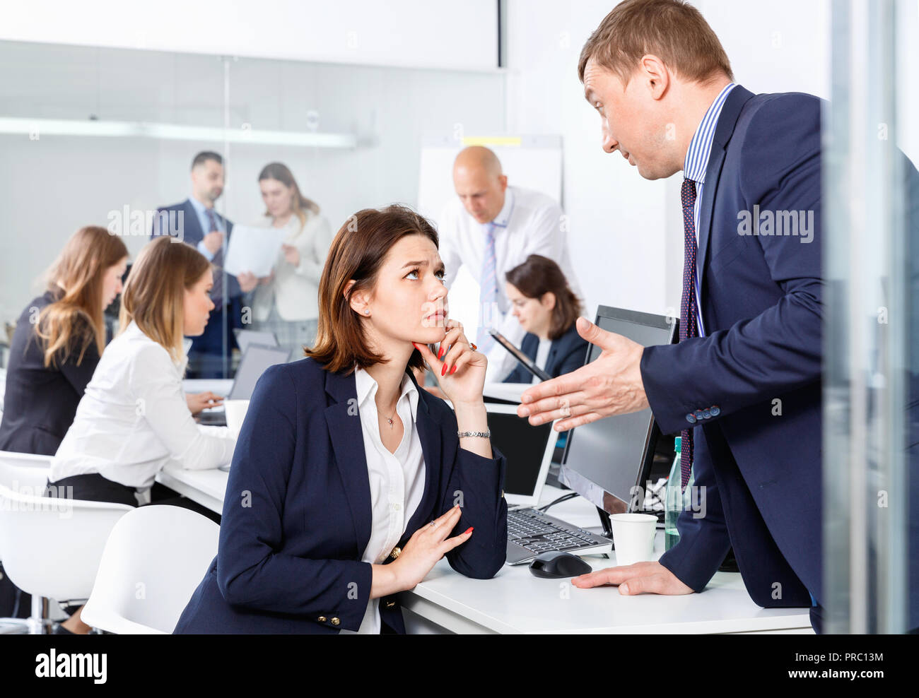 Outraged manager expressing dissatisfaction with work of frustrated ...