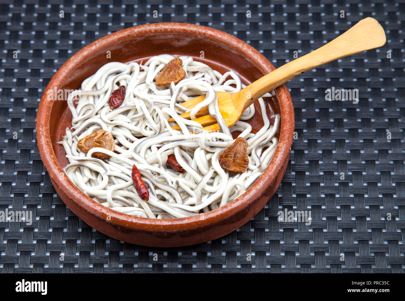 mud casserole with elvers cooked with garlics and bobbies Stock Photo ...