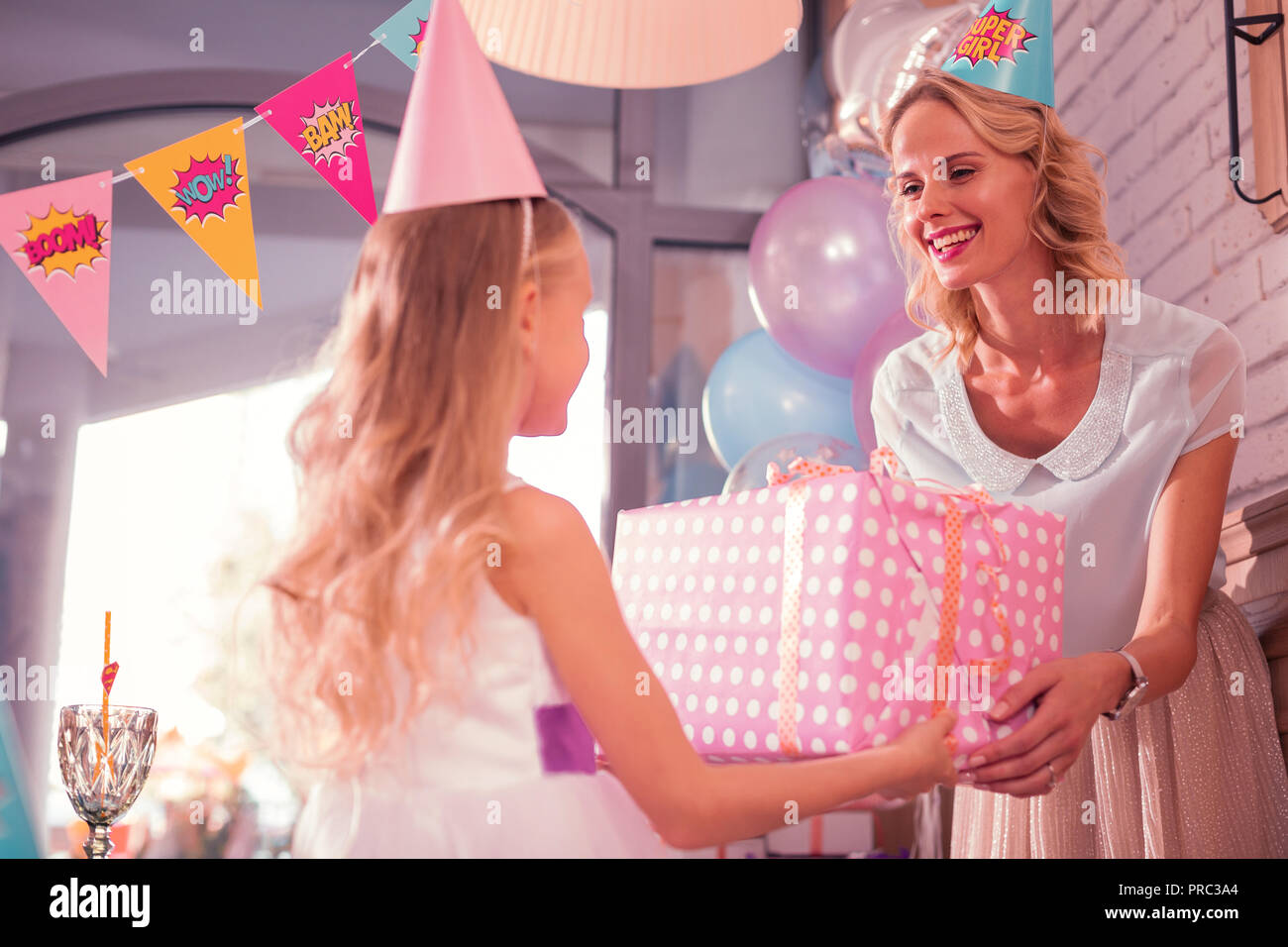 Kind loving mother feeling happy while greeting her daughter Stock ...