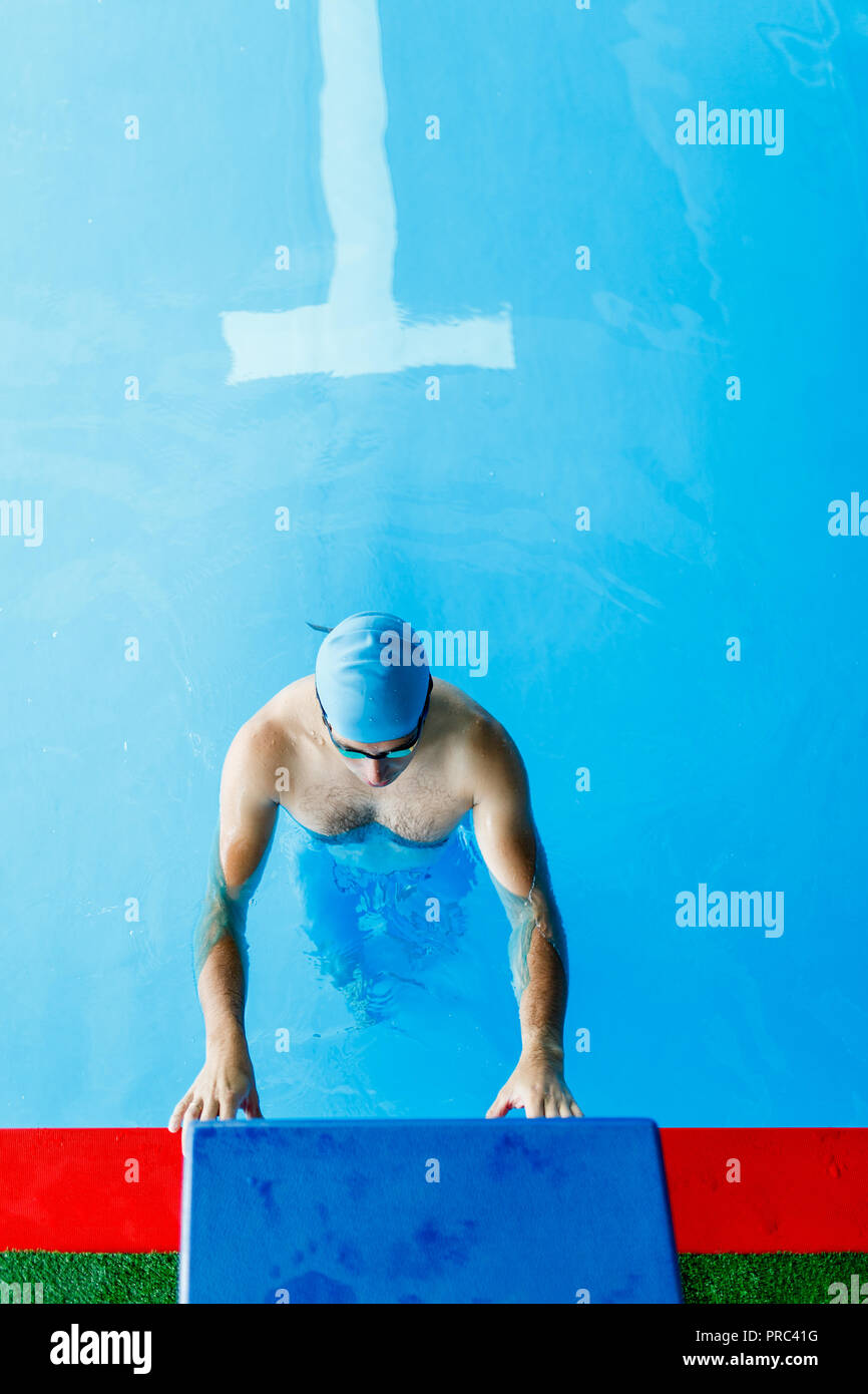 Swimmer standing swimming pool hi-res stock photography and images - Alamy